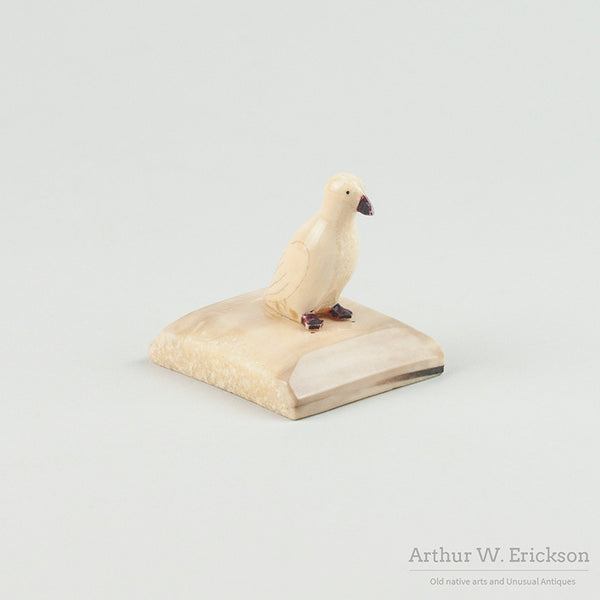 Carved Walrus Ivory Sitting Bird on Fossilized Ivory Mount